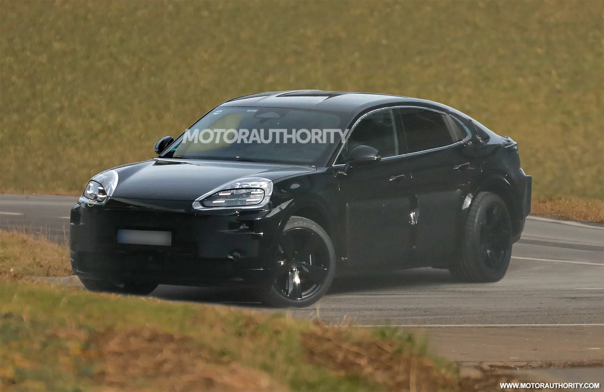 2028 Porsche Cayenne Coupe EV spied for first time AUTOJUNCTION - Autojunction